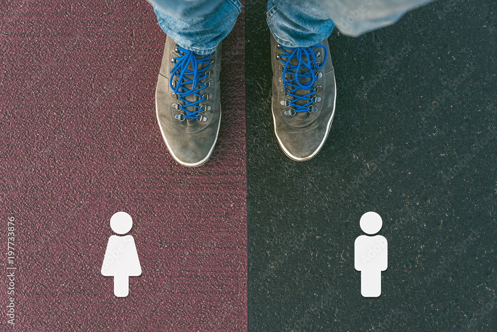Concept of gender gap shown by woman and man symbol and shoes on ... Concept of gender gap shown by woman and man symbol and shoes on ...