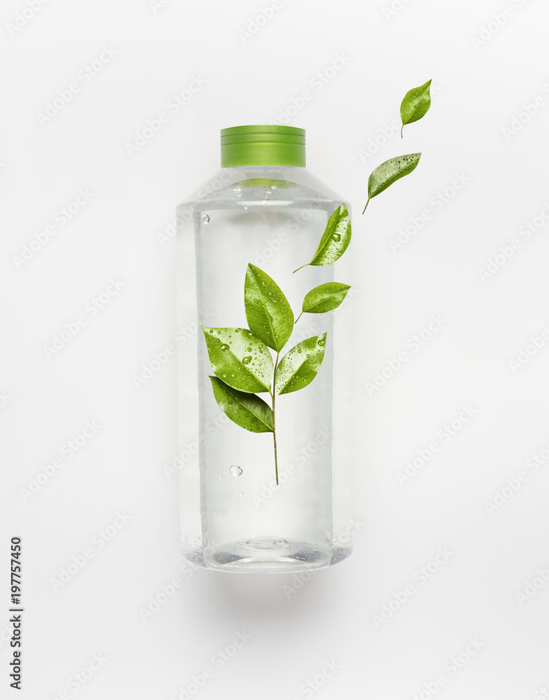 Transparent liquid bottle with green lid. Clear nature water with green ...