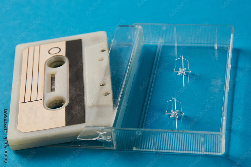 Blank cassette tape box on blue background. Vintage cassette tape case ...