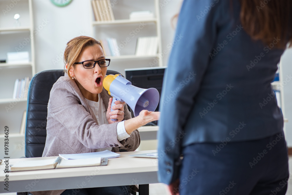 Angry woman boss yelling at her female employee Stock Photo | Adobe Stock