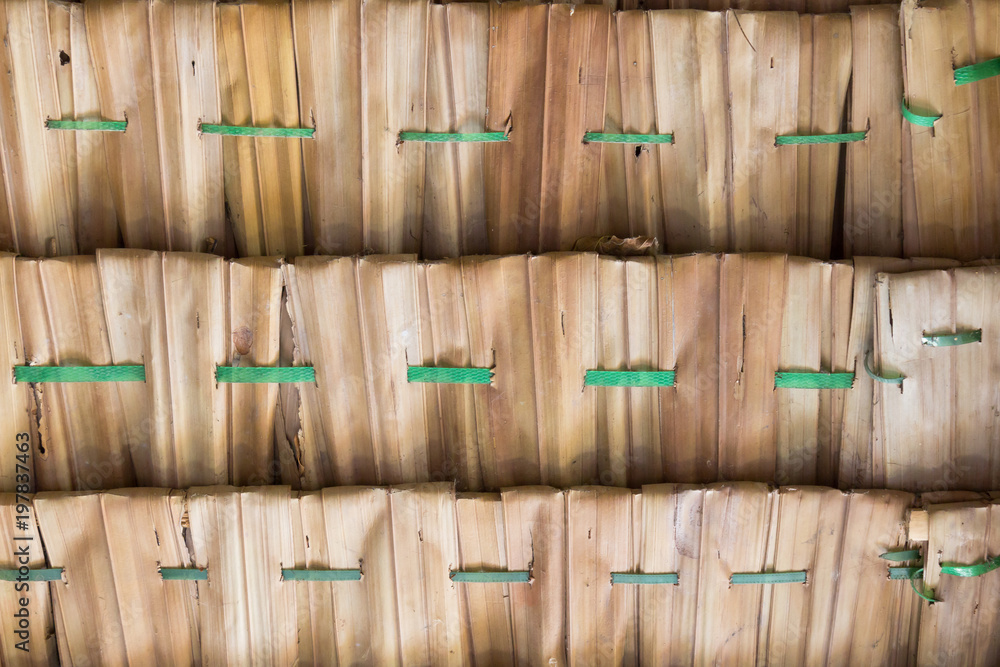 palm frond roof, made from the foliage branches of the palm tree. hand ...