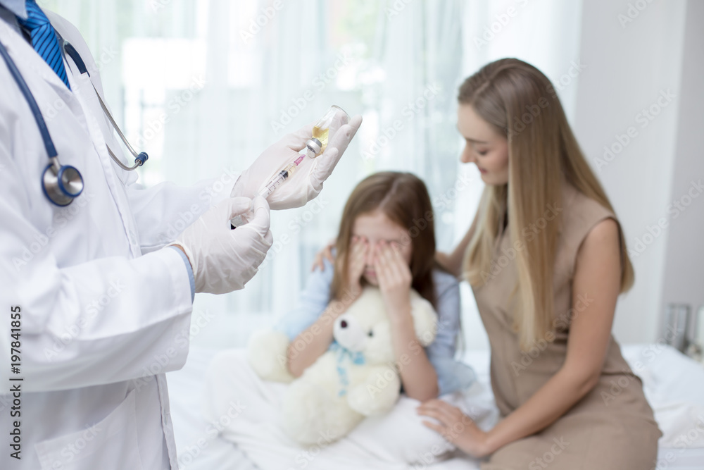 Girl scary to injection from doctor at hospital. People with medical ...
