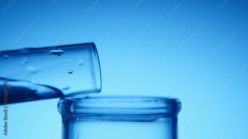 A macro shot of two test tubes touching each other cautiously ...