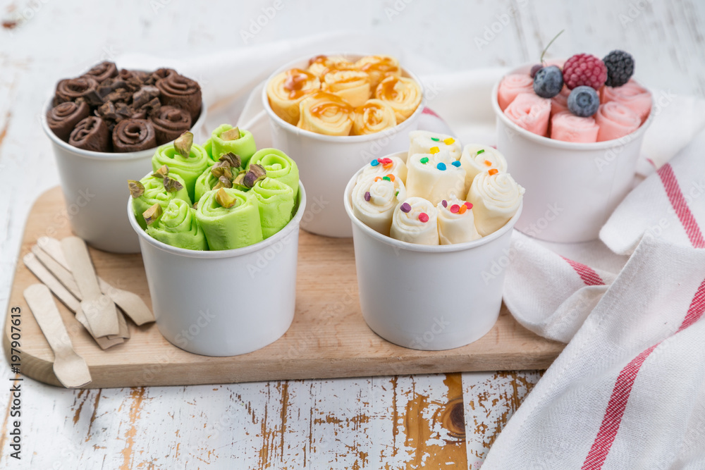 Selection of different rolled ice creams in cone cups Stock Photo ...