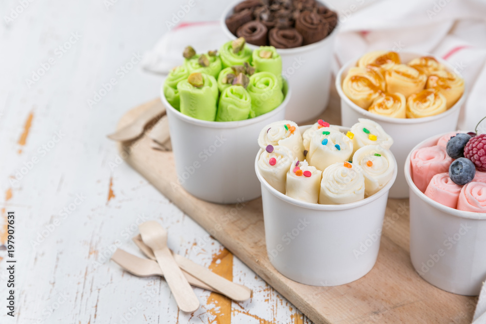 Selection of different rolled ice creams in cone cups Stock Photo ...