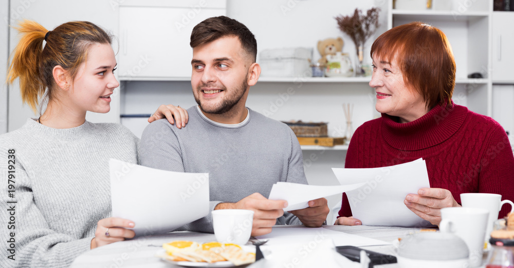 Happy family reading mail together Stock Photo | Adobe Stock