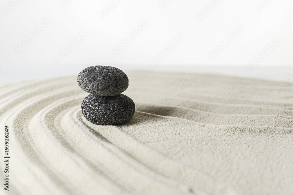 Zen stone garden on white sand Stock Photo | Adobe Stock