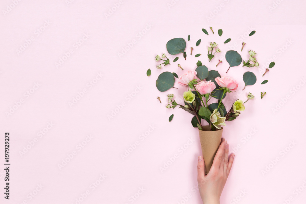 Top view of floral composition of beautiful pink rose flower in kraft ...
