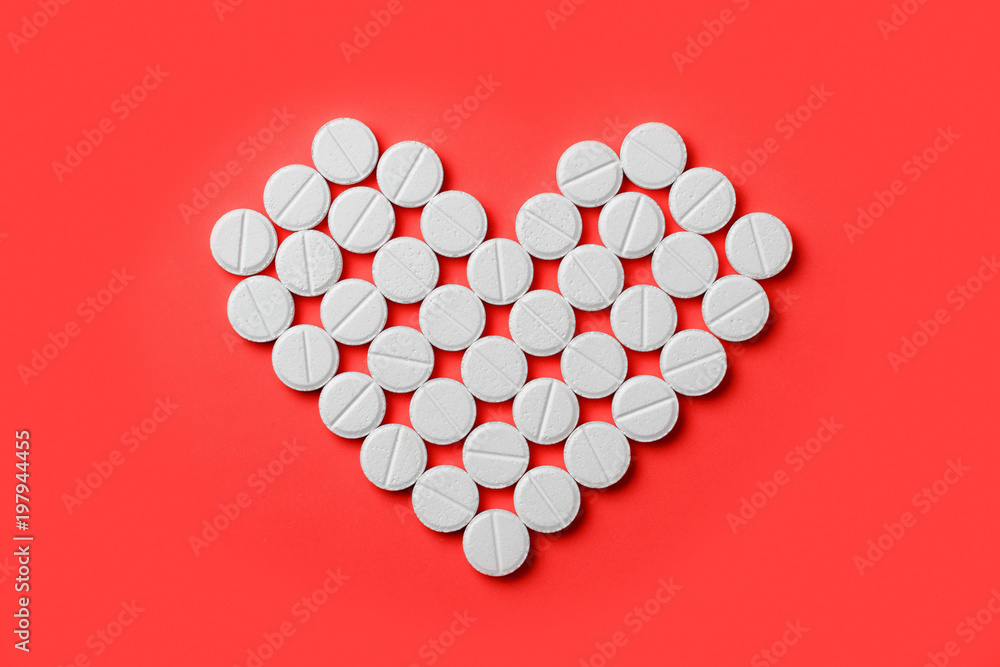 Heart medications on a red background Stock Photo | Adobe Stock