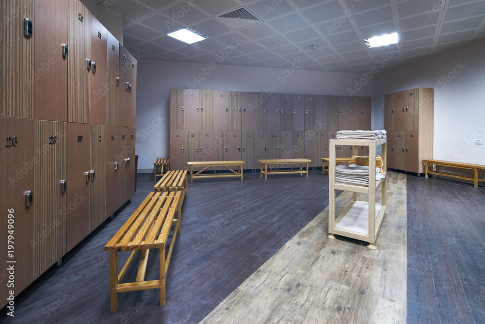 Interior of gym locker room. Luxury and clean dressing room with wooden ...