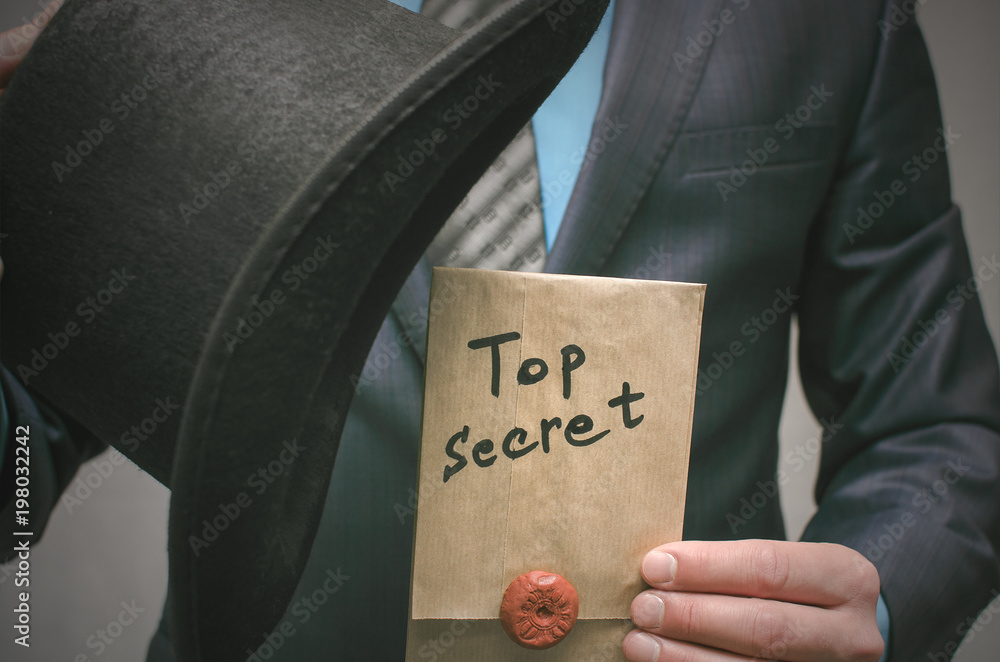 Top secret concept. Open the secret. Business man takes out secret ...