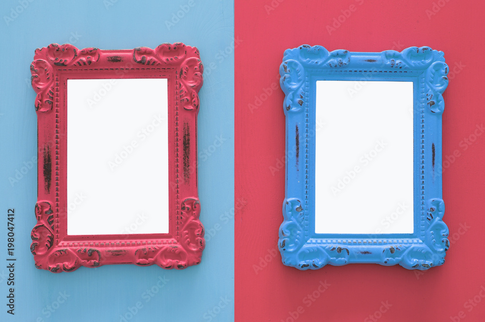 Vintage blank blue and red photo frames over double colorful background ...