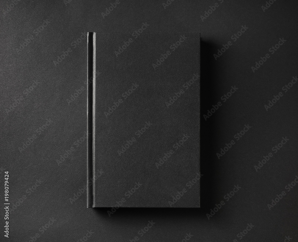 Photo of blank black book cover on black paper background. Flat lay ...