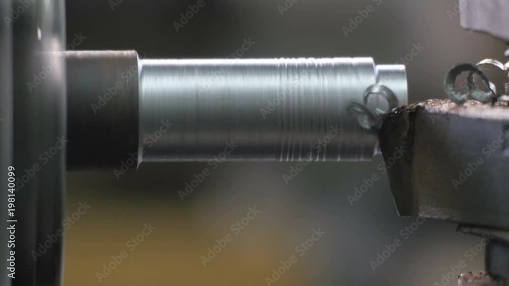 Turning lathe in action. Facing operation of a metal blank on turning ...