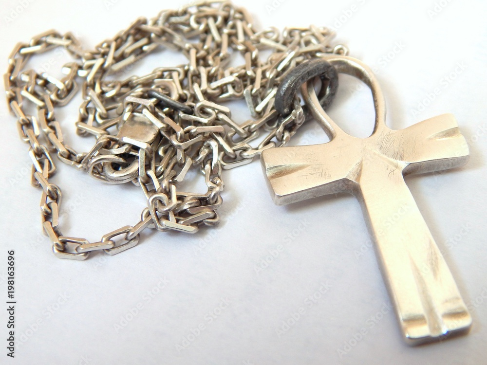 Silver ankh on a silver chain. Jewelry. The cross Ankh is a symbol of ...