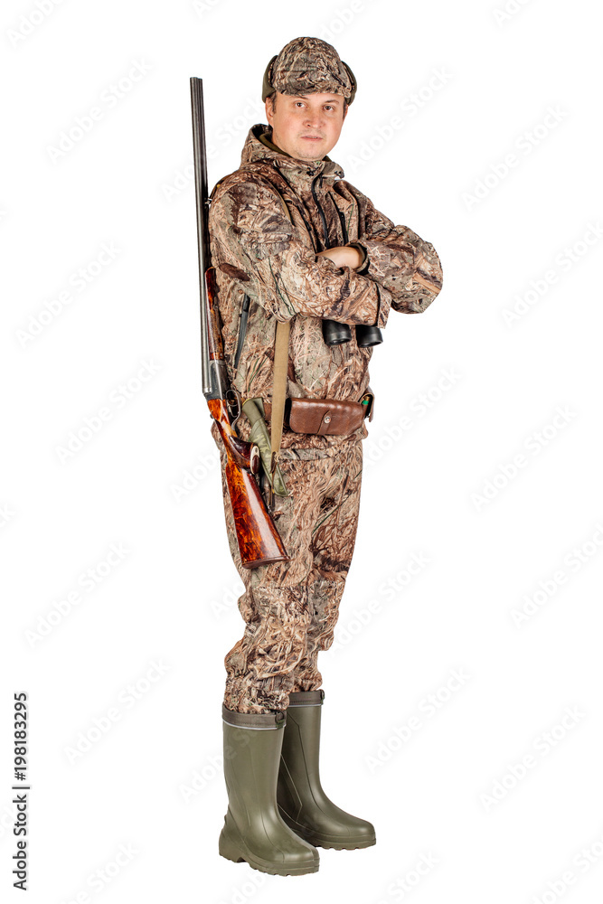 Full length portrait of a male hunter with double barreled shotgun ...