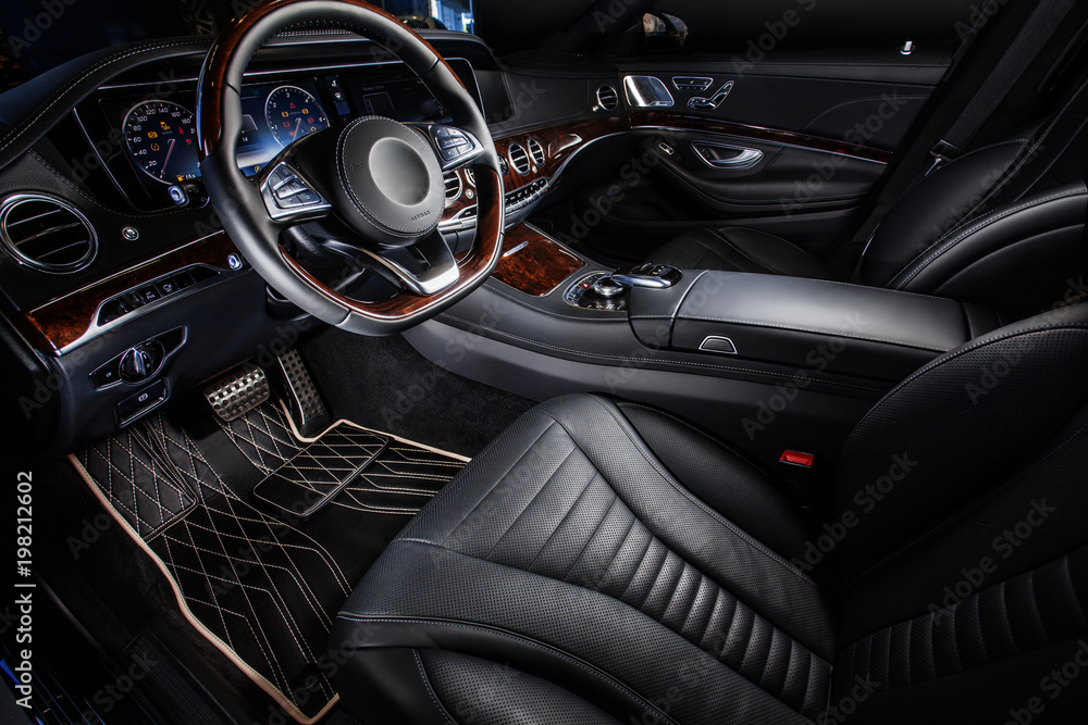 Luxury car interior. Steering wheel, shift lever and dashboard. Stock ...