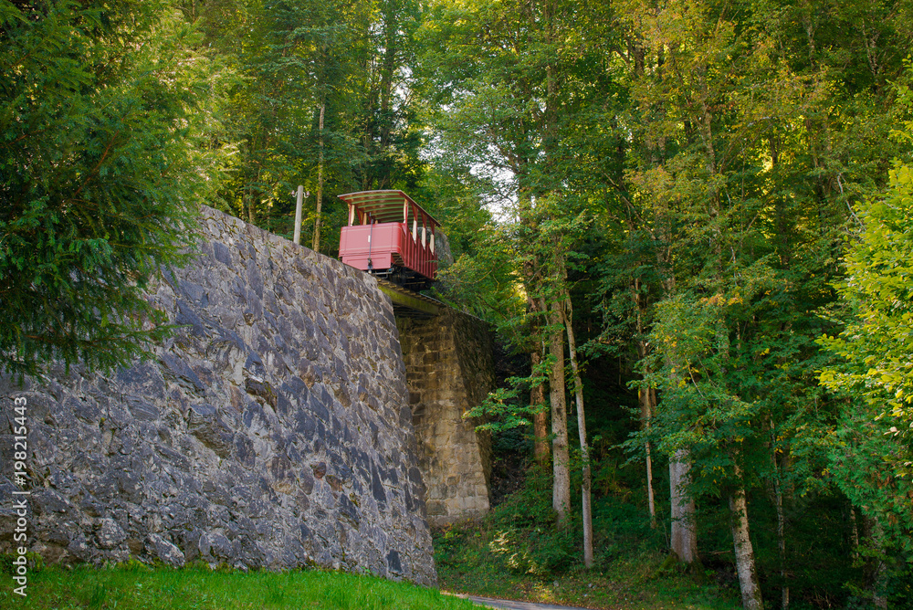 Foto de Red car of a tourist train. funicular cabin rides up ...