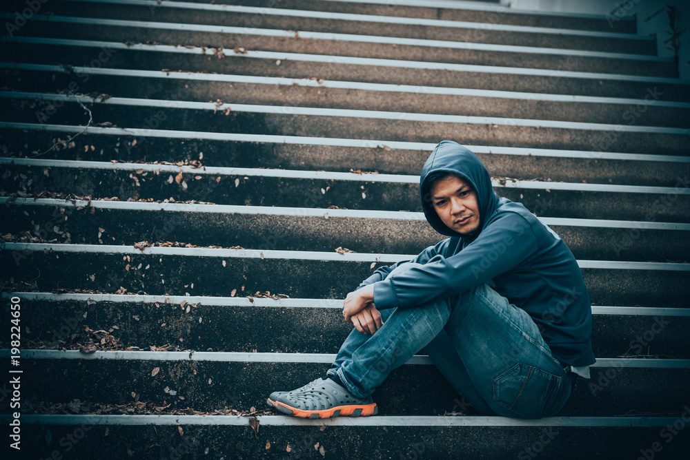 Portrait of asian man sad,drug addict man sitting on the floor,flakka ...