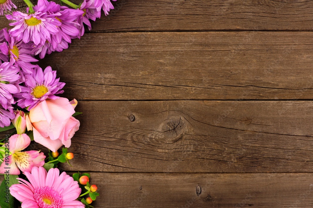 Side border of pink and purple flowers with rose, daisies and lilies ...
