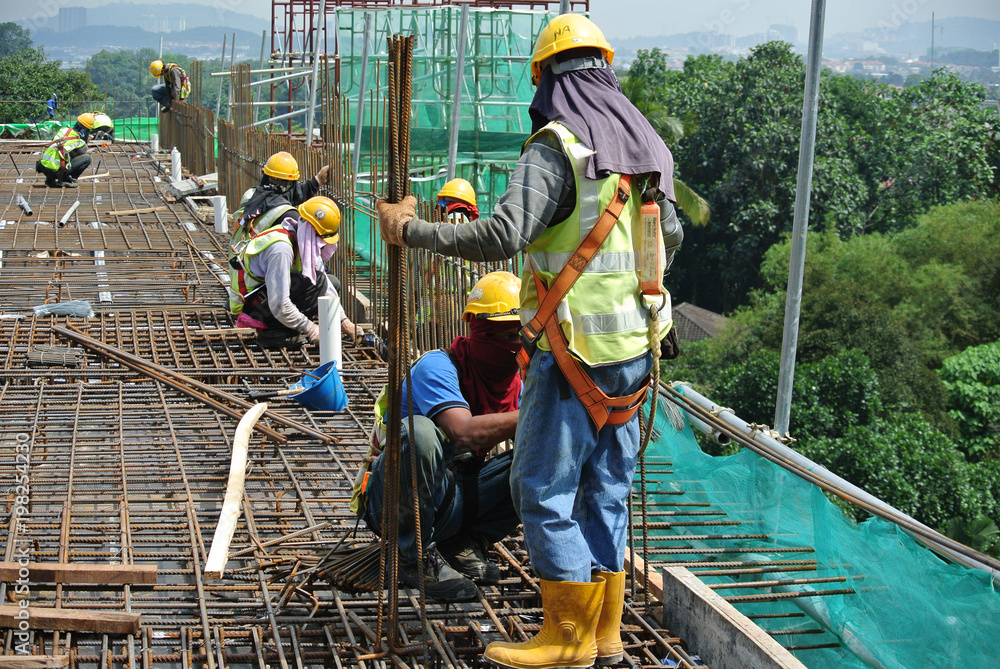 Construction workers fabricating steel reinforcement bar at the ...