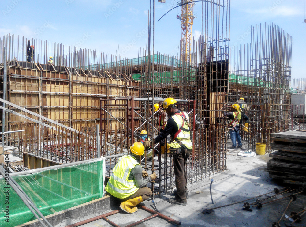 Construction workers fabricating steel reinforcement bar at the ...