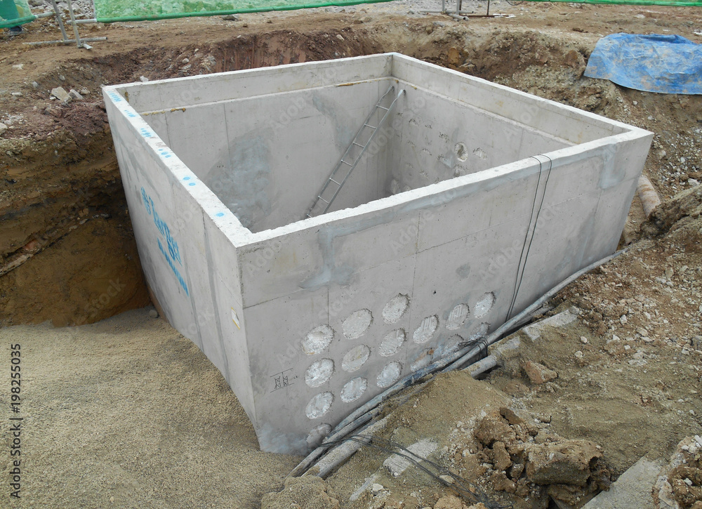 Precast concrete manhole for underground utility services under ...