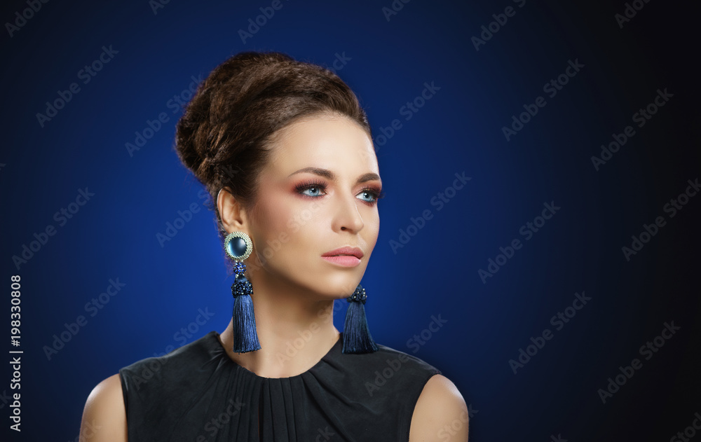 Young, beautiful and rich woman in jewels of platinum and stones over ...