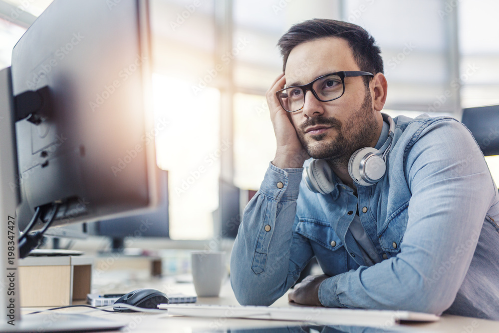 Bored programmer Stock Photo | Adobe Stock