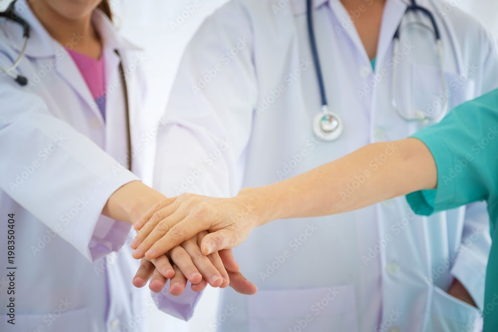 Teamwork concept, doctors thumb up together at hospital. Close up hands ...