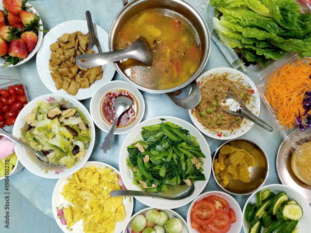 Variety of mix culture food on dining table, Eastern and Western, Asian ...