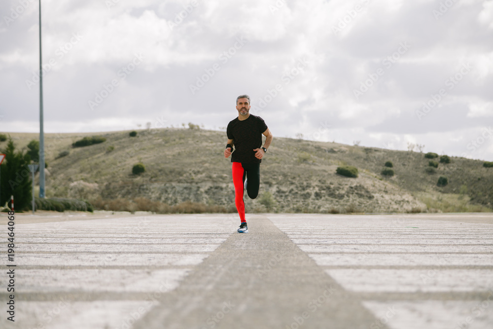 Man running towards the camera Stock Photo | Adobe Stock