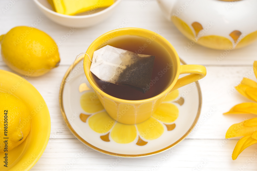 Bright Yellow Tea Set on a White Wood Table Stock Photo | Adobe Stock