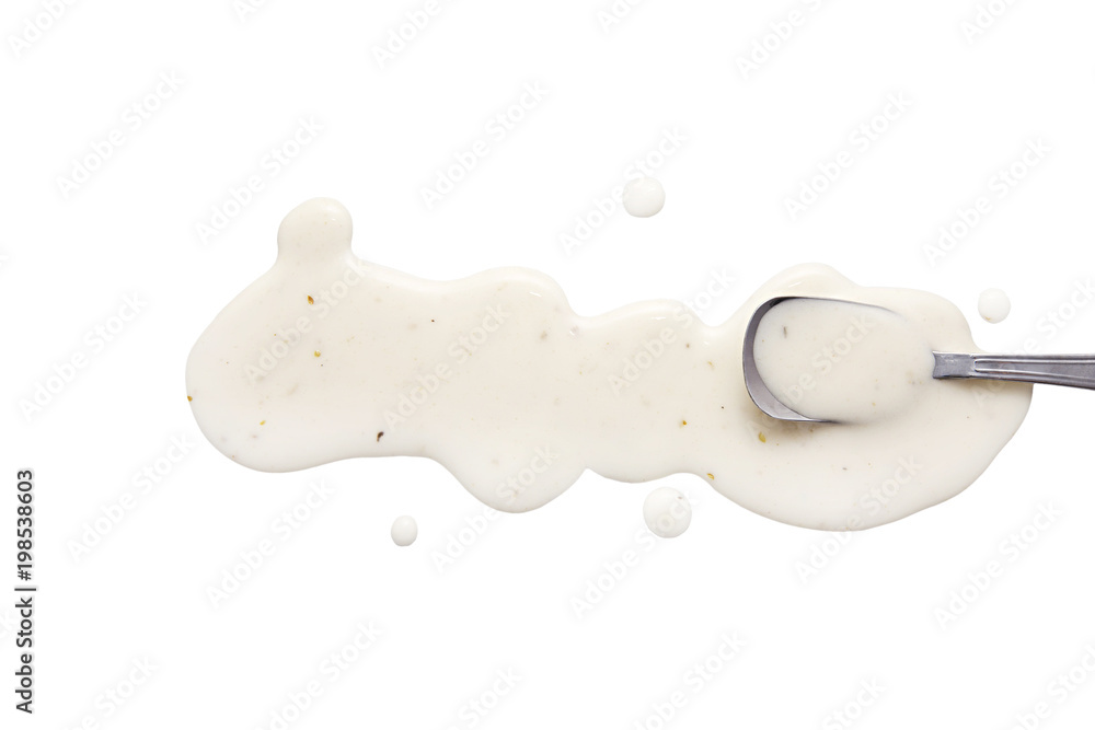 splashes and spilled ranch dressing with a spoon. isolated on white ...