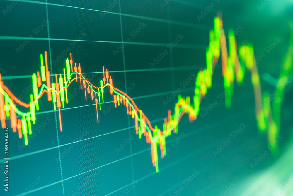 Stock market graph analysis. Stock market data on LED display on laptop ...