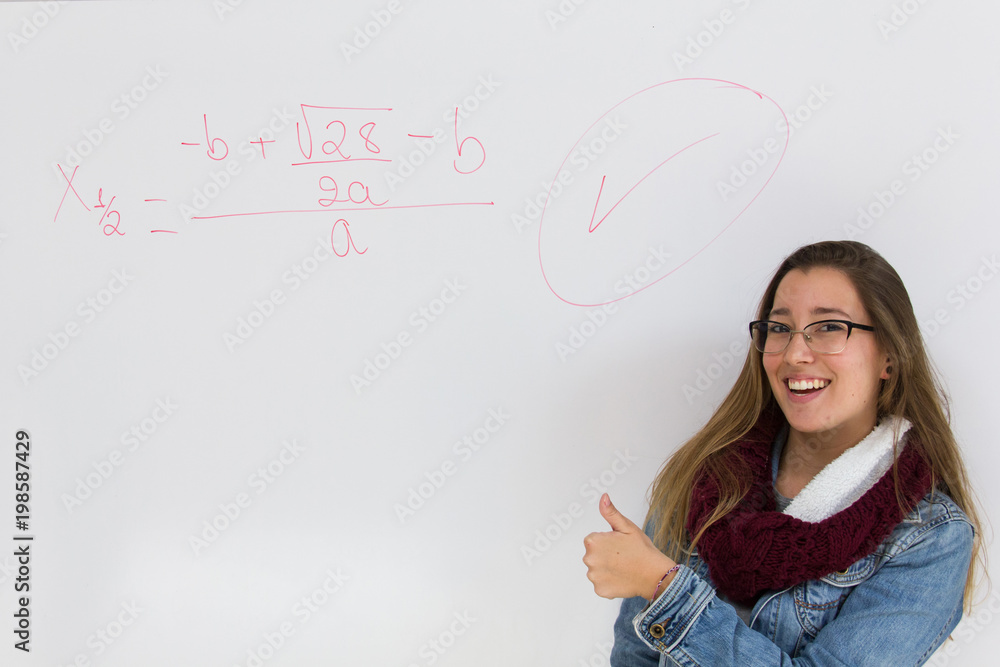 Happy blonde girl with thumb up smiling to correct math equation ...