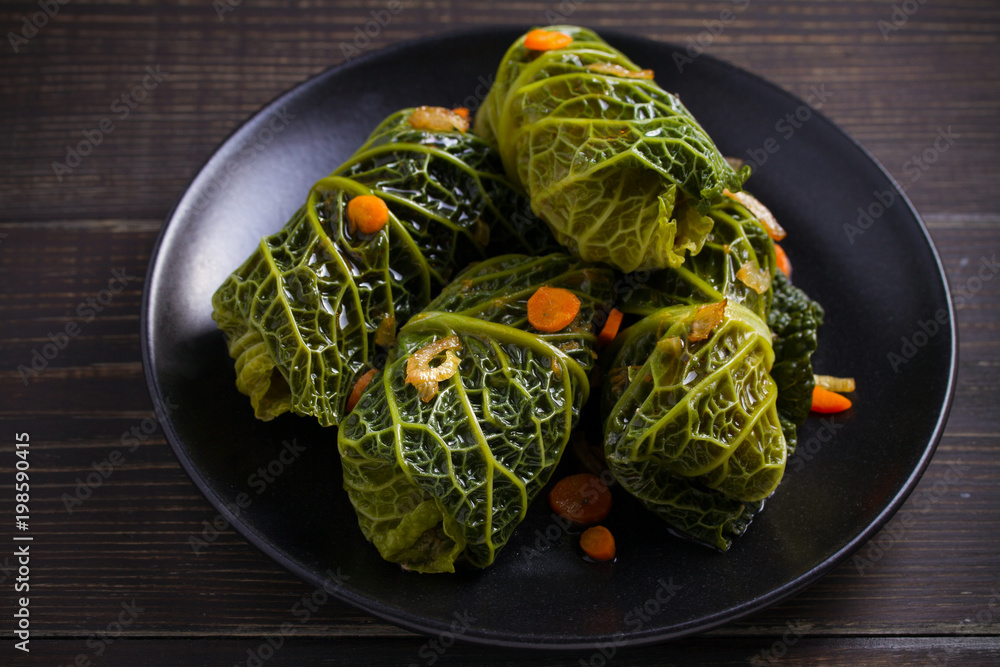 Stuffed cabbage leaves. Cabbage rolls. Savoy cabbage leaves wrapped ...