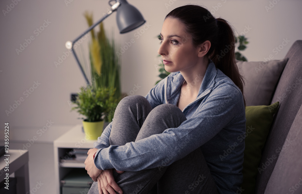 Sad woman at home Stock Photo | Adobe Stock