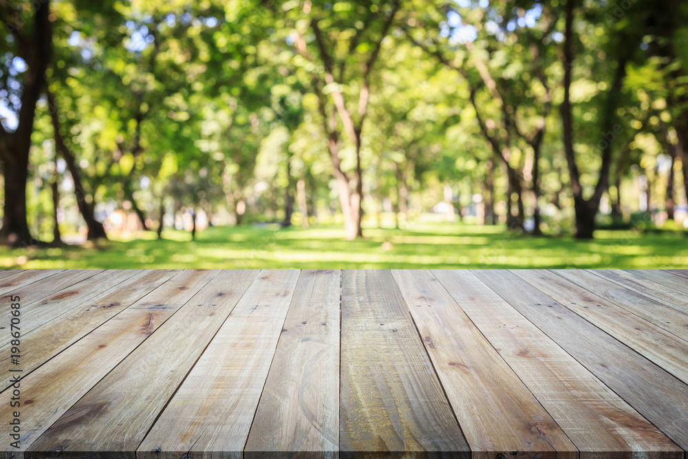 Wooden board or table and abstract blurred background. Free space can ...
