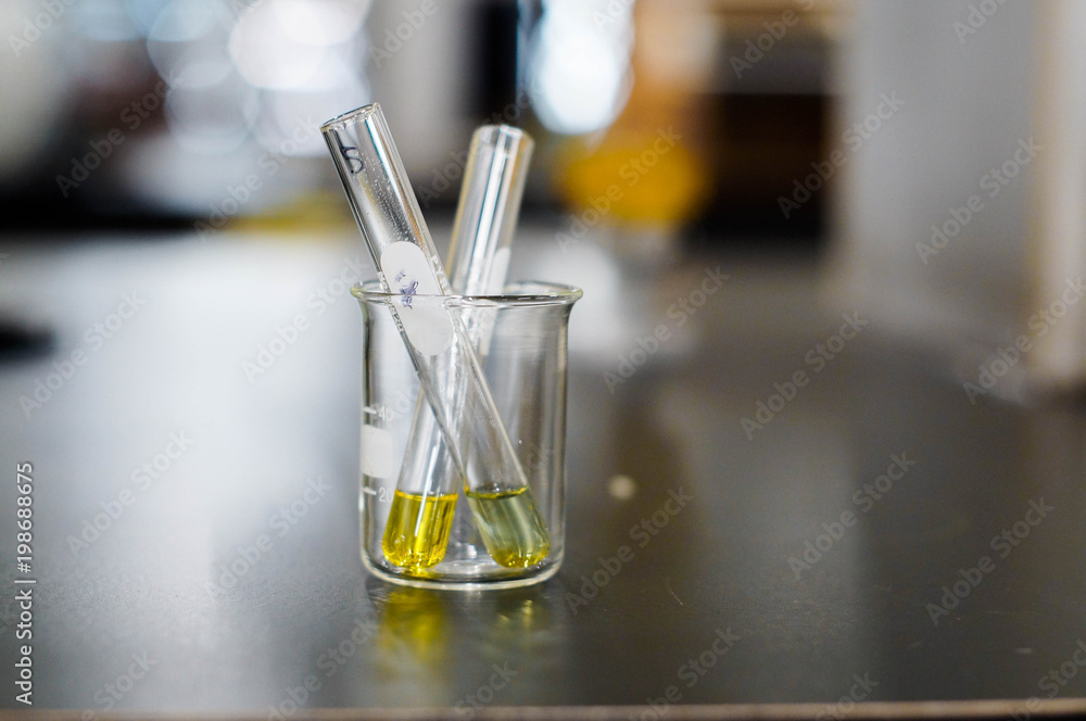 green solution and yellow solution in test tube in beaker Stock Photo ...