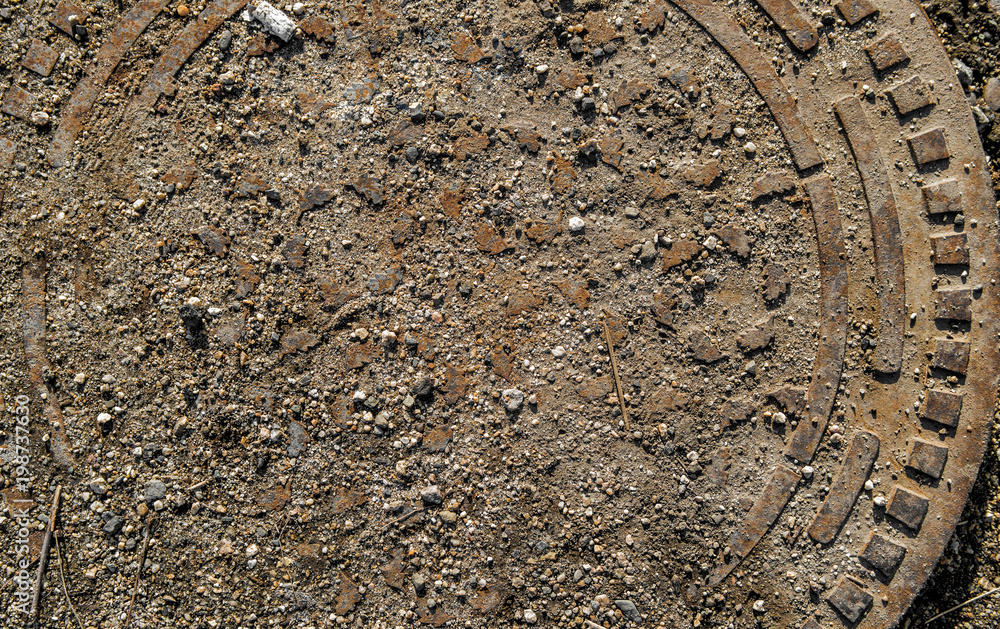 Sewer cover metal texture. Closeup of old and rusty manhole cover ...