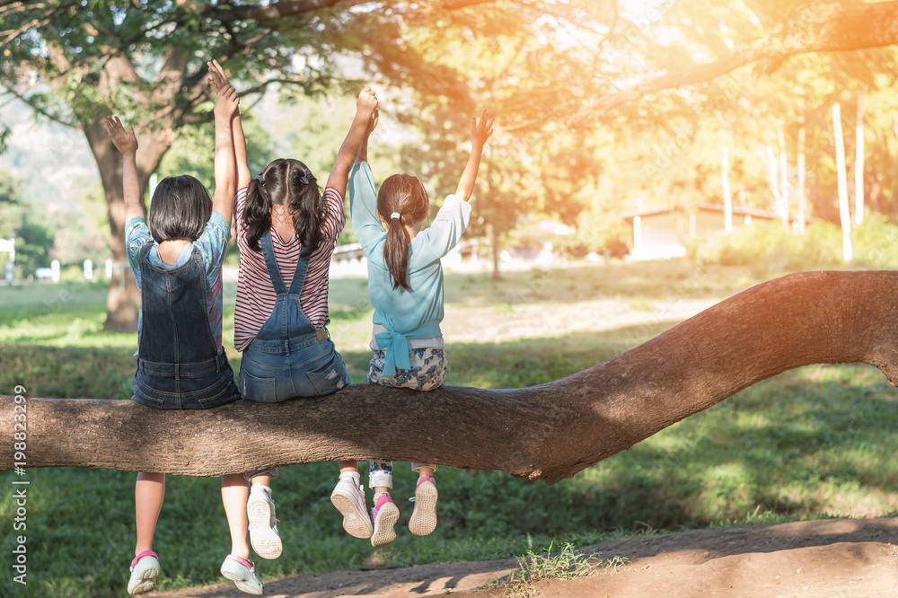 Foto de Children friendship concept with happy girl kids in the park ...