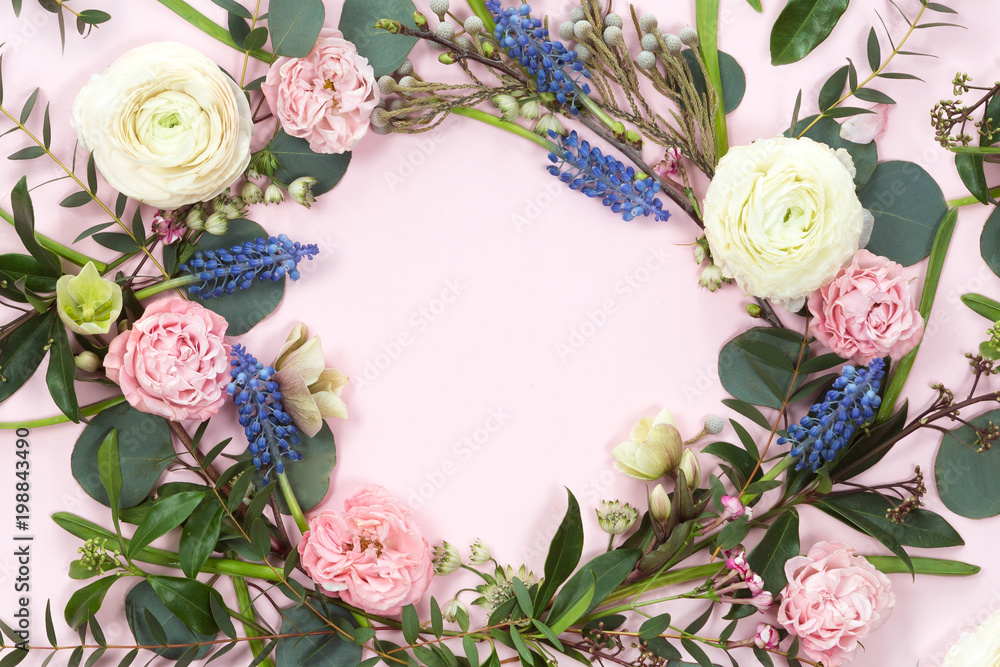 Top view of round flower frame wreath with roses, ranunculus, leaves ...