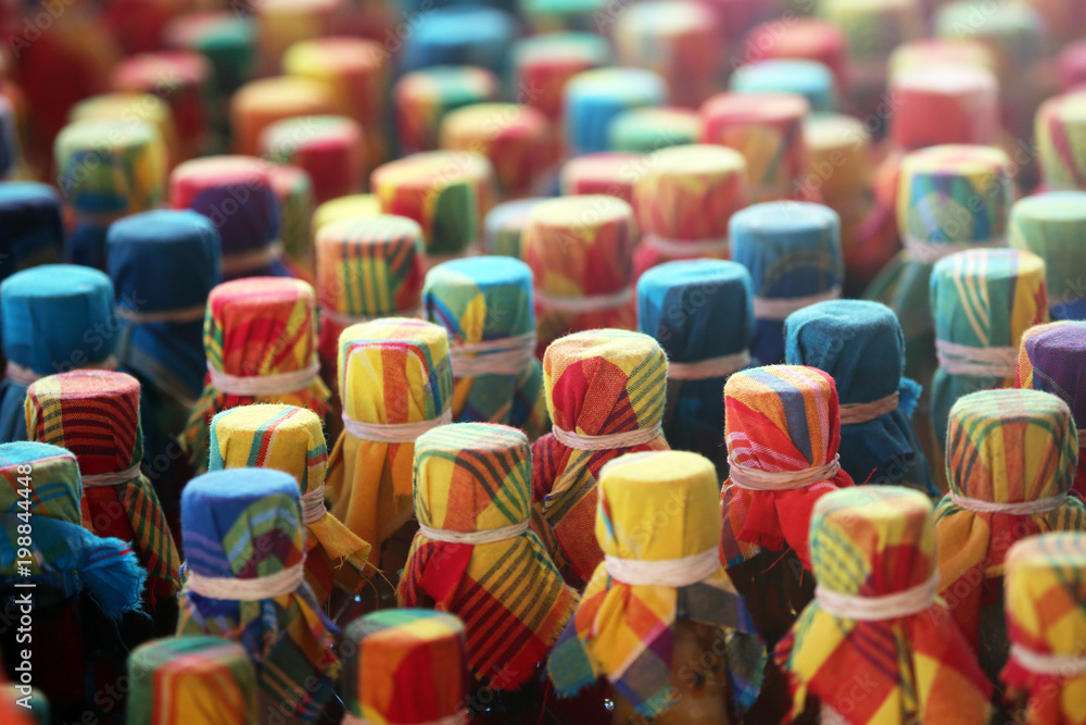 detail of colorful cloth covers on bottles of Ti-Punch made of rum ...