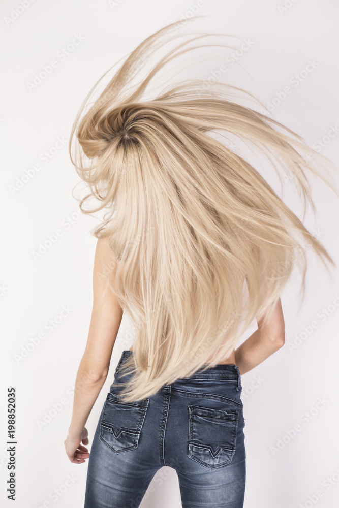 Beautifuly flying long platinum blonde hair. Stock Photo | Adobe Stock