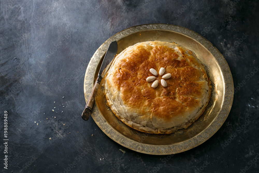 Moroccan bastilla on copper palte, space for wording Stock Photo ...