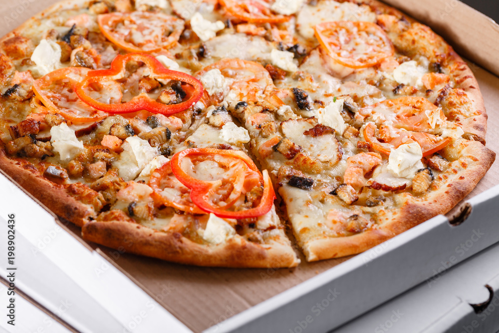 Pizza box delivery concept. Open box with hot tasty italian sliced ...