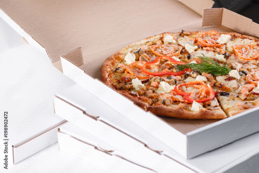 Pizza box delivery concept. Open box with hot tasty italian sliced ...