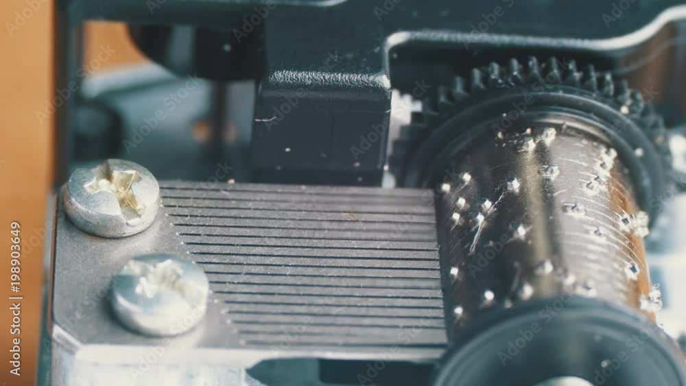 The music box mechanism rotates close-up. Detailed view of the insides ...