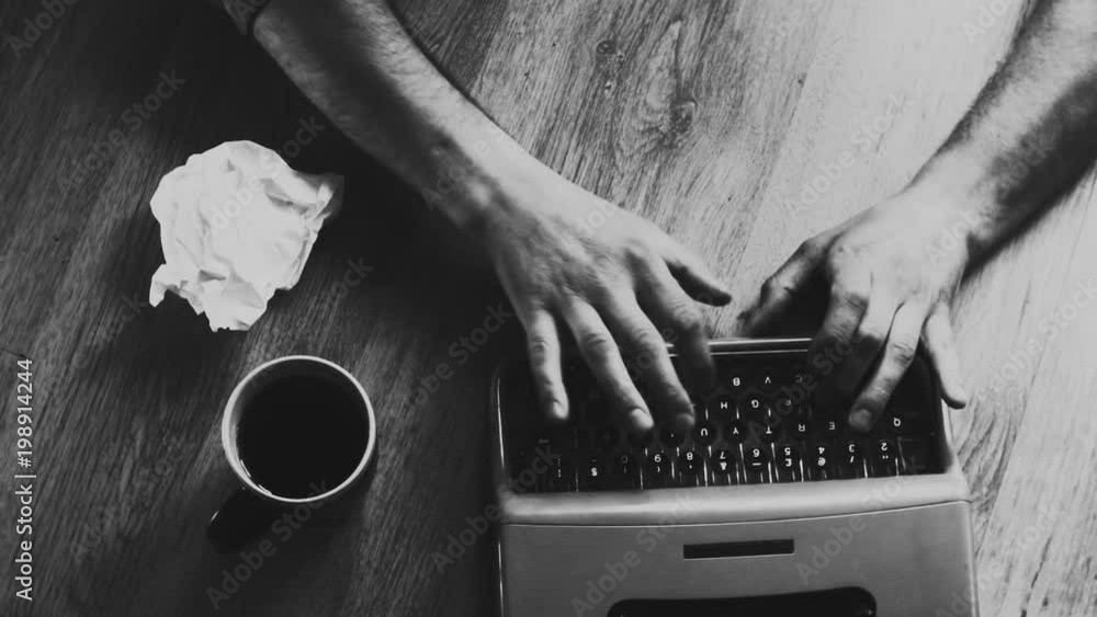 Person typing on a vintage typewriter with vintage 35mm camera, after ...